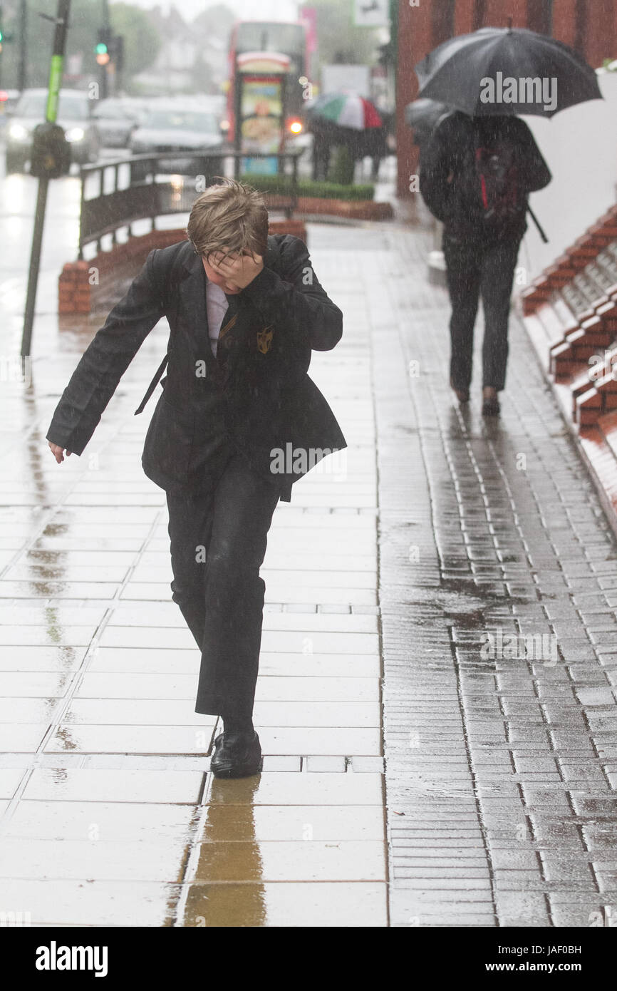 London UK. 6th June 2017. A school boy struggles against the cold ...