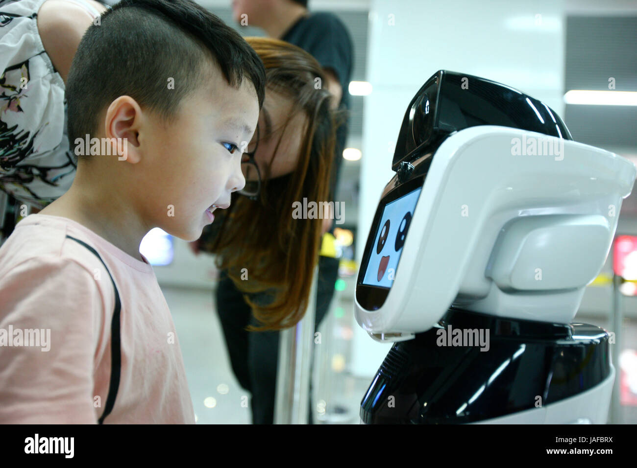 Robot child help hi-res stock photography and images - Alamy