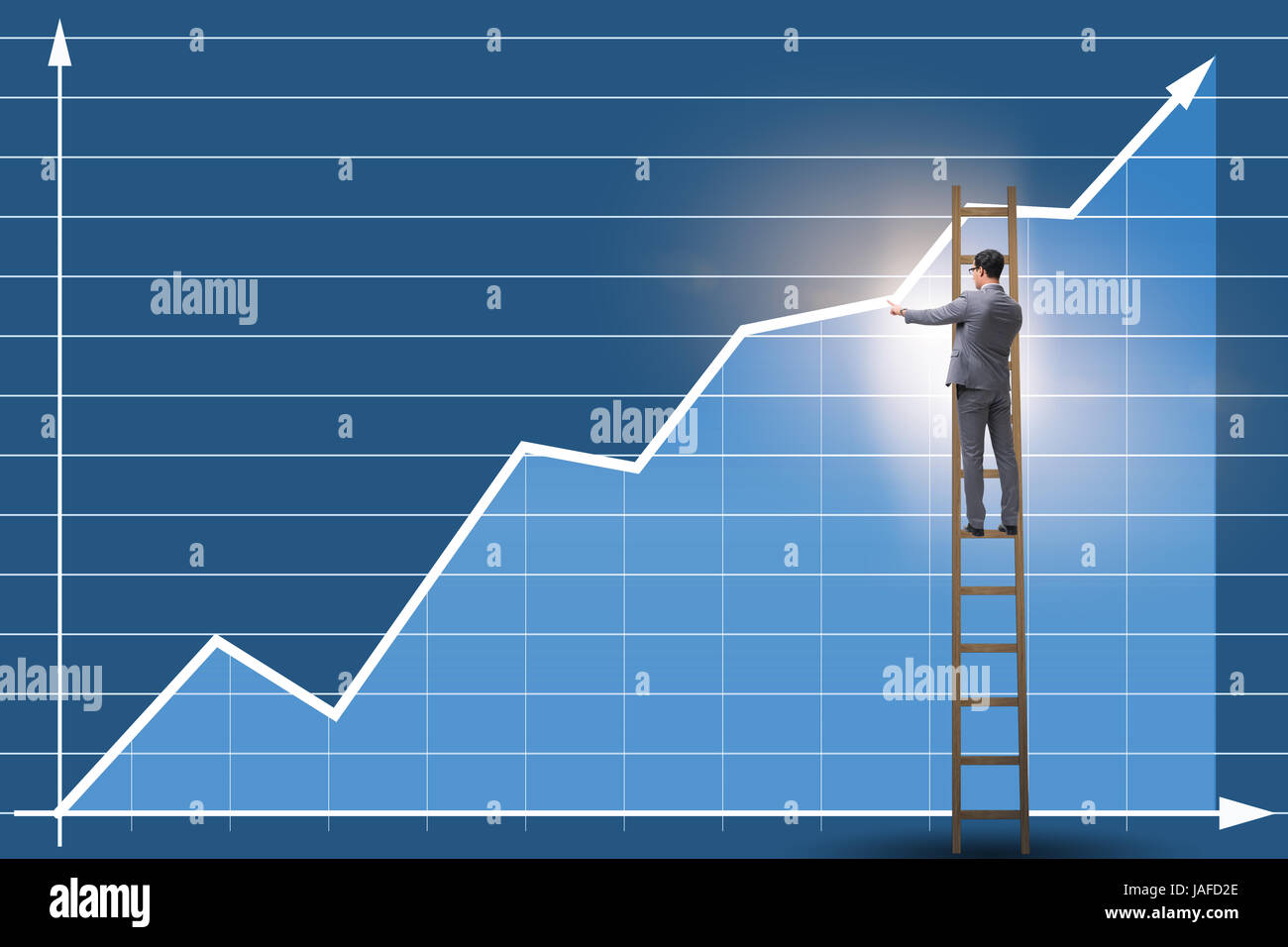 Businessman drawing charts standing on ladder Stock Photo - Alamy