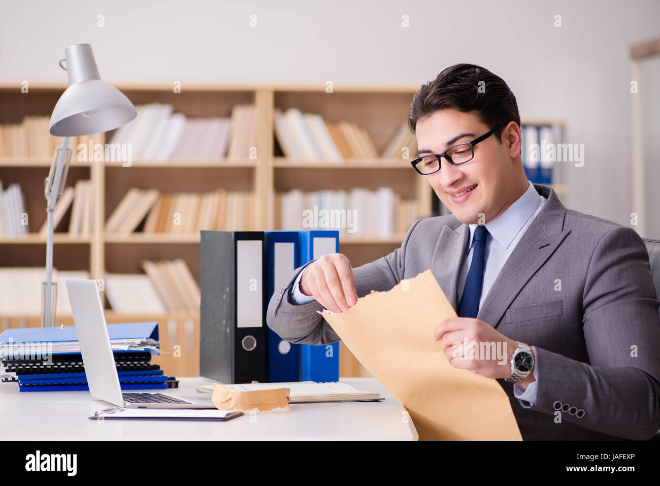 Businessman receiving letter in the office Stock Photo - Alamy