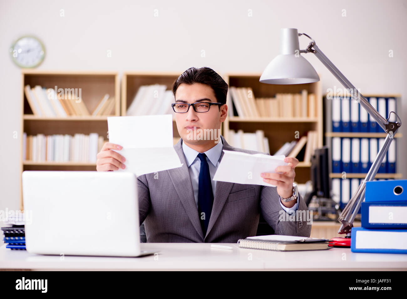 Businessman receiving letter envelope in office Stock Photo - Alamy
