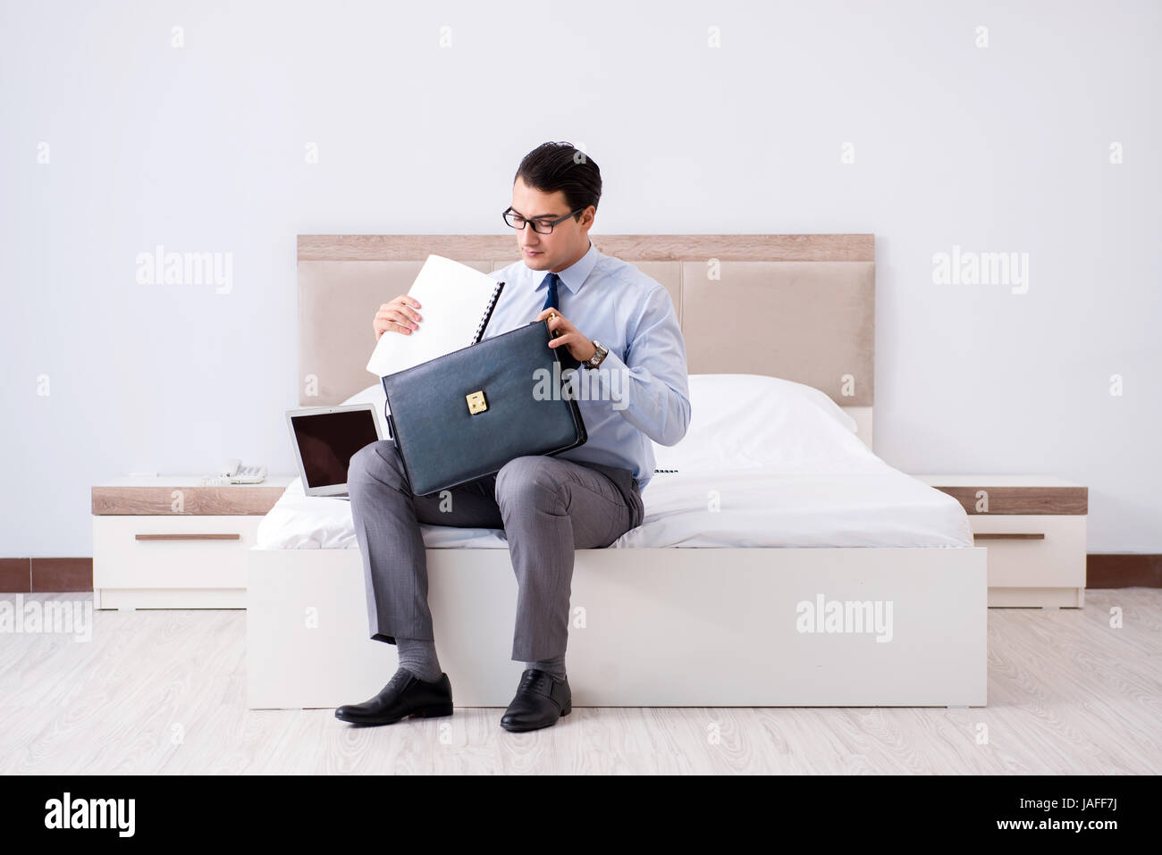 Businessman working in hotel room Stock Photo - Alamy