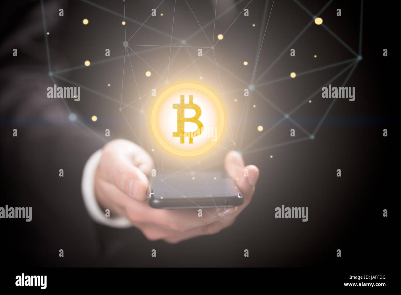 Businessman with bitcoin sign , smartphone Stock Photo - Alamy