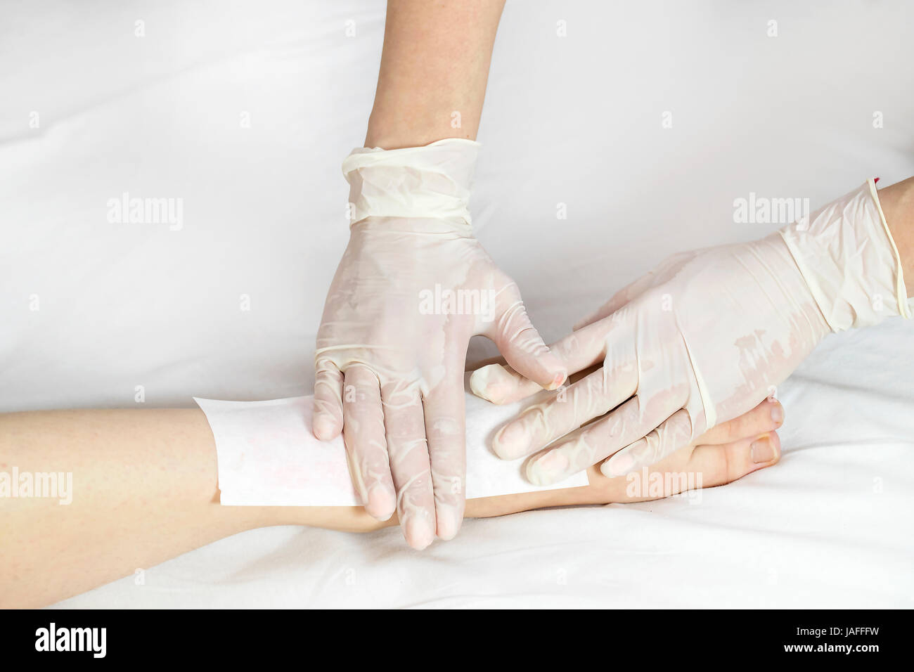 Process depilation female legs and hands in a beauty salon Stock Photo ...
