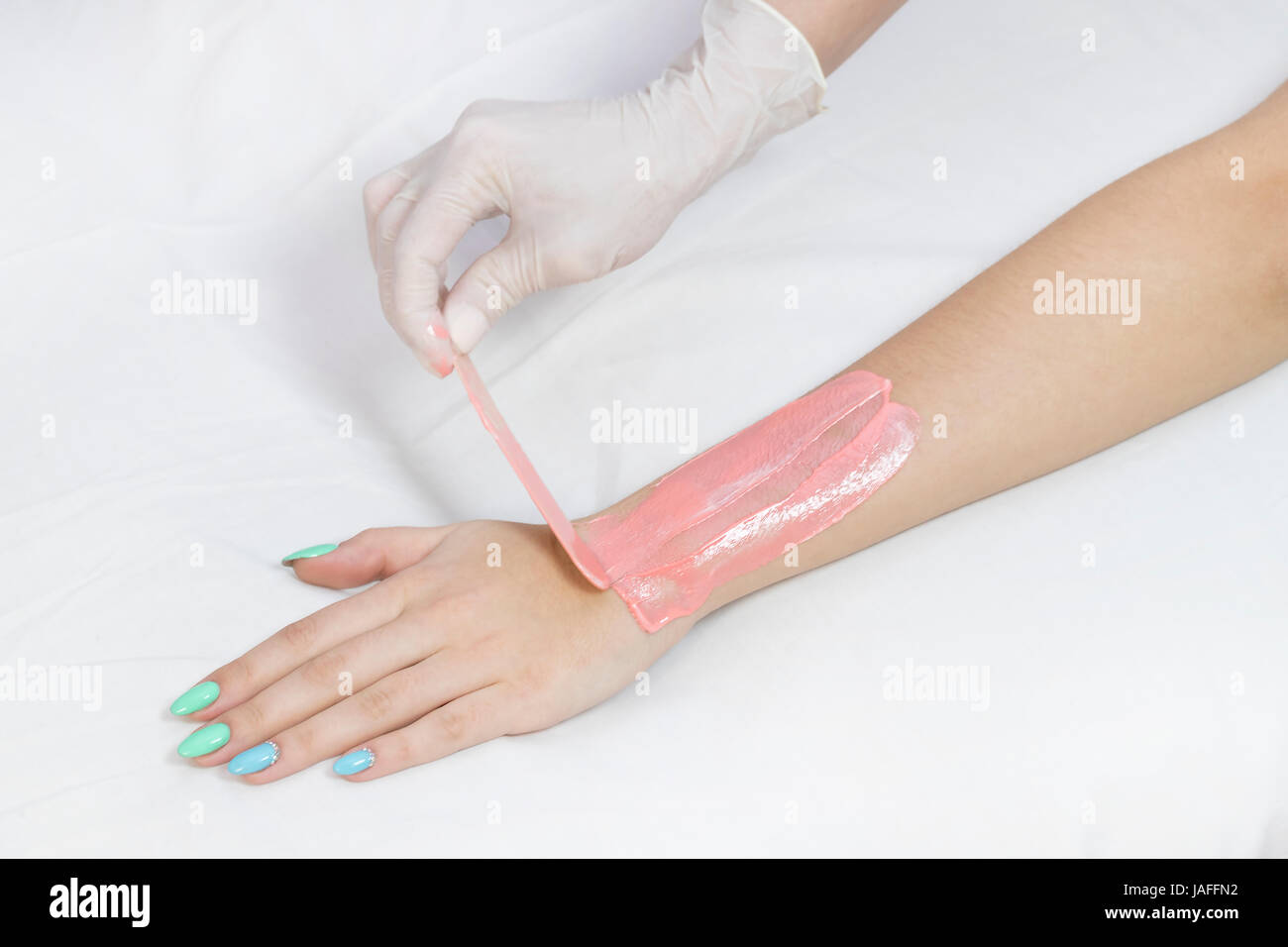 Process depilation female legs and hands in a beauty salon Stock Photo ...
