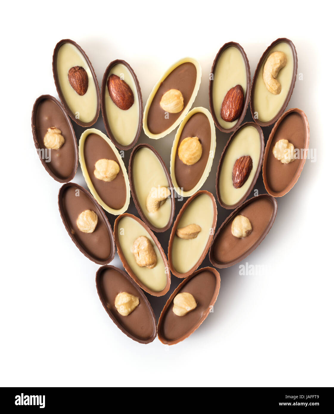 Chocolate candy with nut on white isolated background Stock Photo - Alamy
