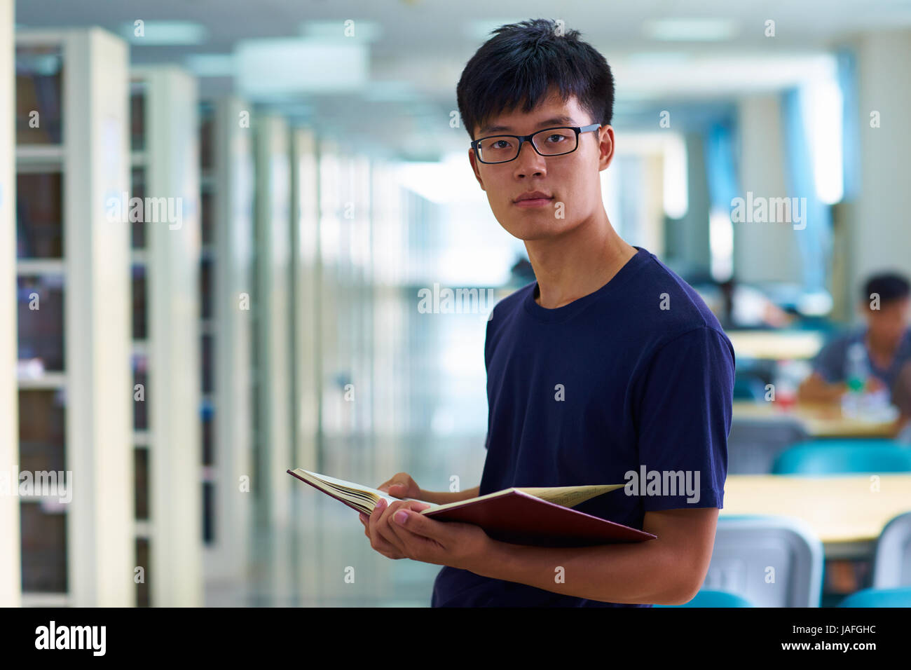 Asian man serious looking at camera hi-res stock photography and images ...