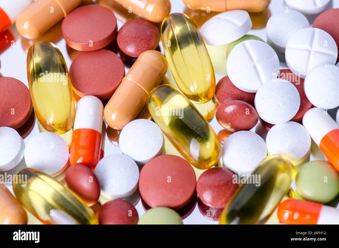 many different colored pills Stock Photo - Alamy