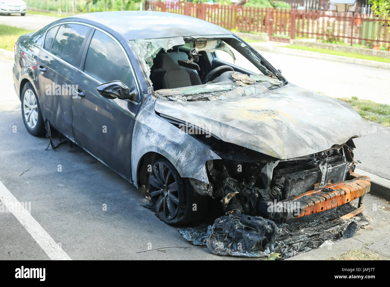 The exterior of a burned out car at a parking lot Stock Photo - Alamy