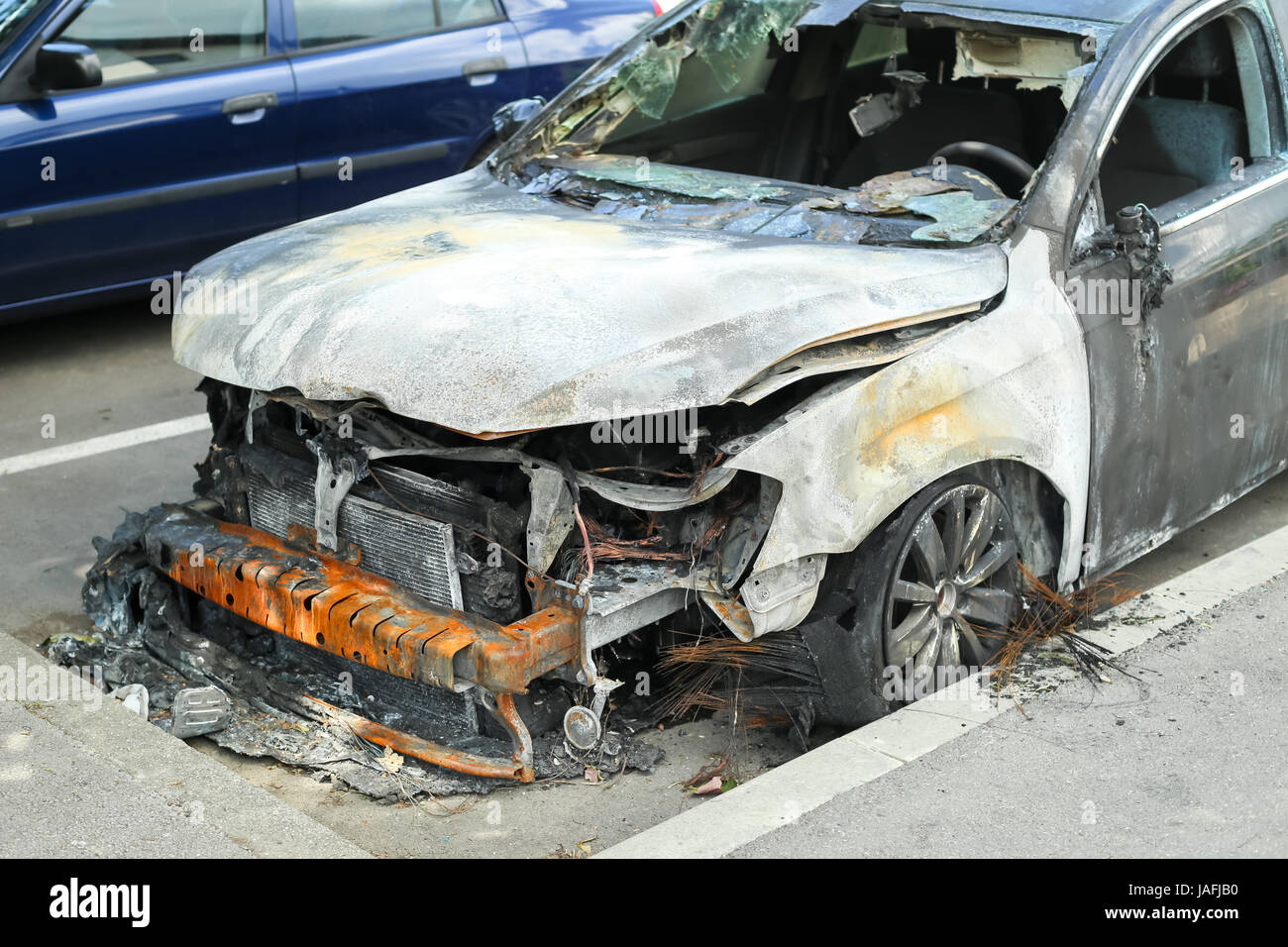 The exterior of a burned out car at a parking lot Stock Photo - Alamy