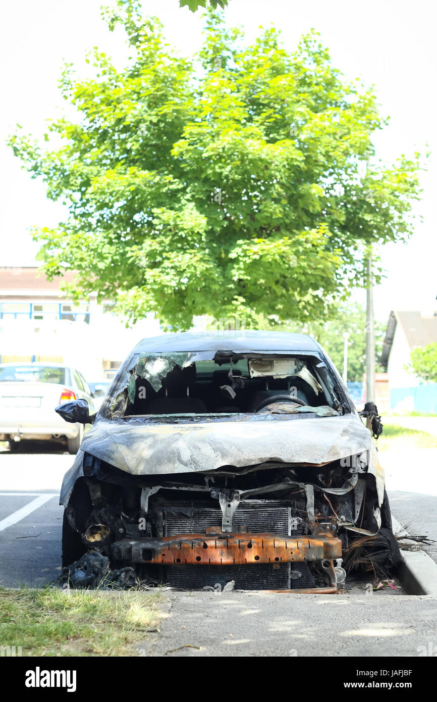 The exterior of a burned out car at a parking lot Stock Photo - Alamy