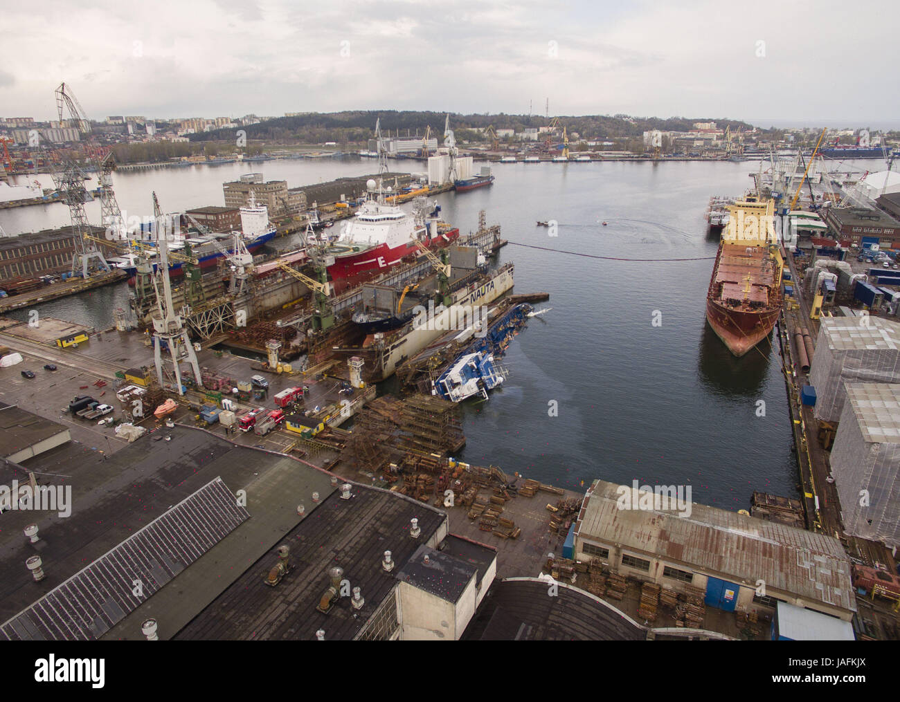 A floating dry dock holding a Norwegian tanker capsized Thursday ...
