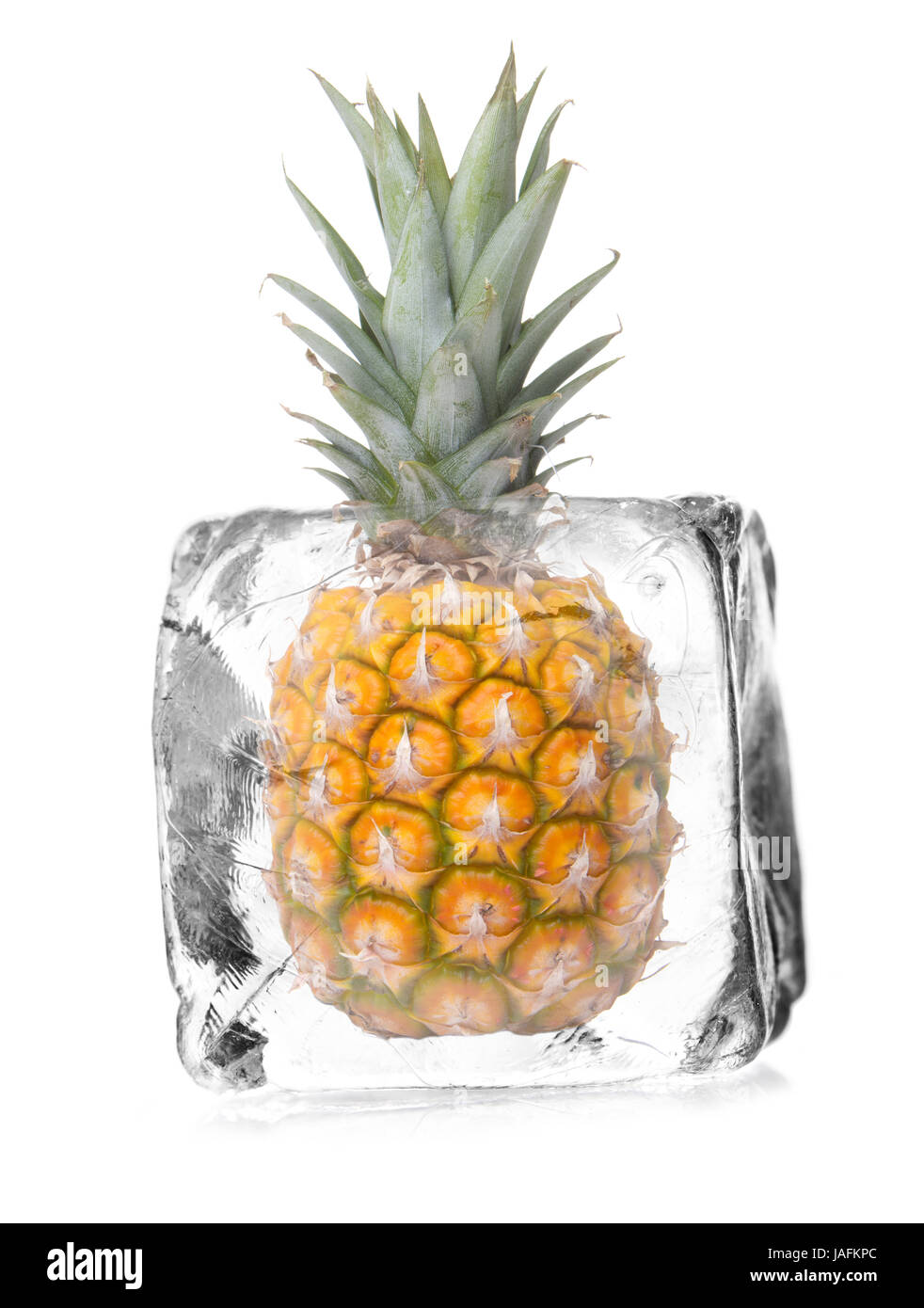 pineapple released in an ice cube,isolated with white background Stock ...