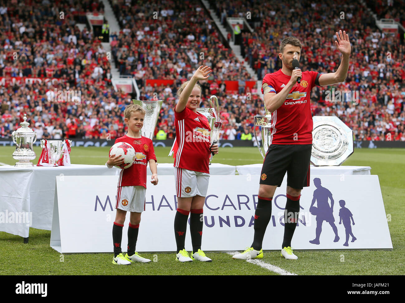 Michael Carrick speaks next to his children Jacey and Louise before his ...