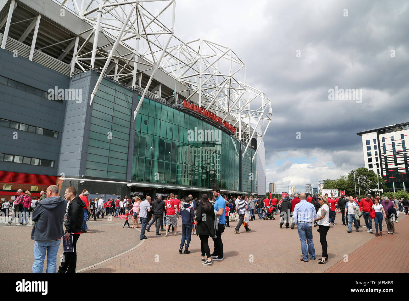 Fans outside the stadium before the game Stock Photo - Alamy