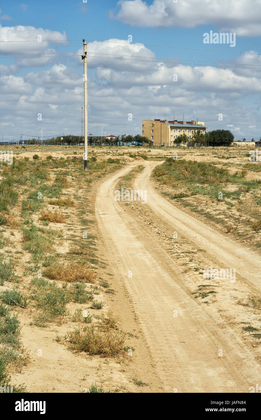 Ground road and power line pole in the countryside Stock Photo - Alamy