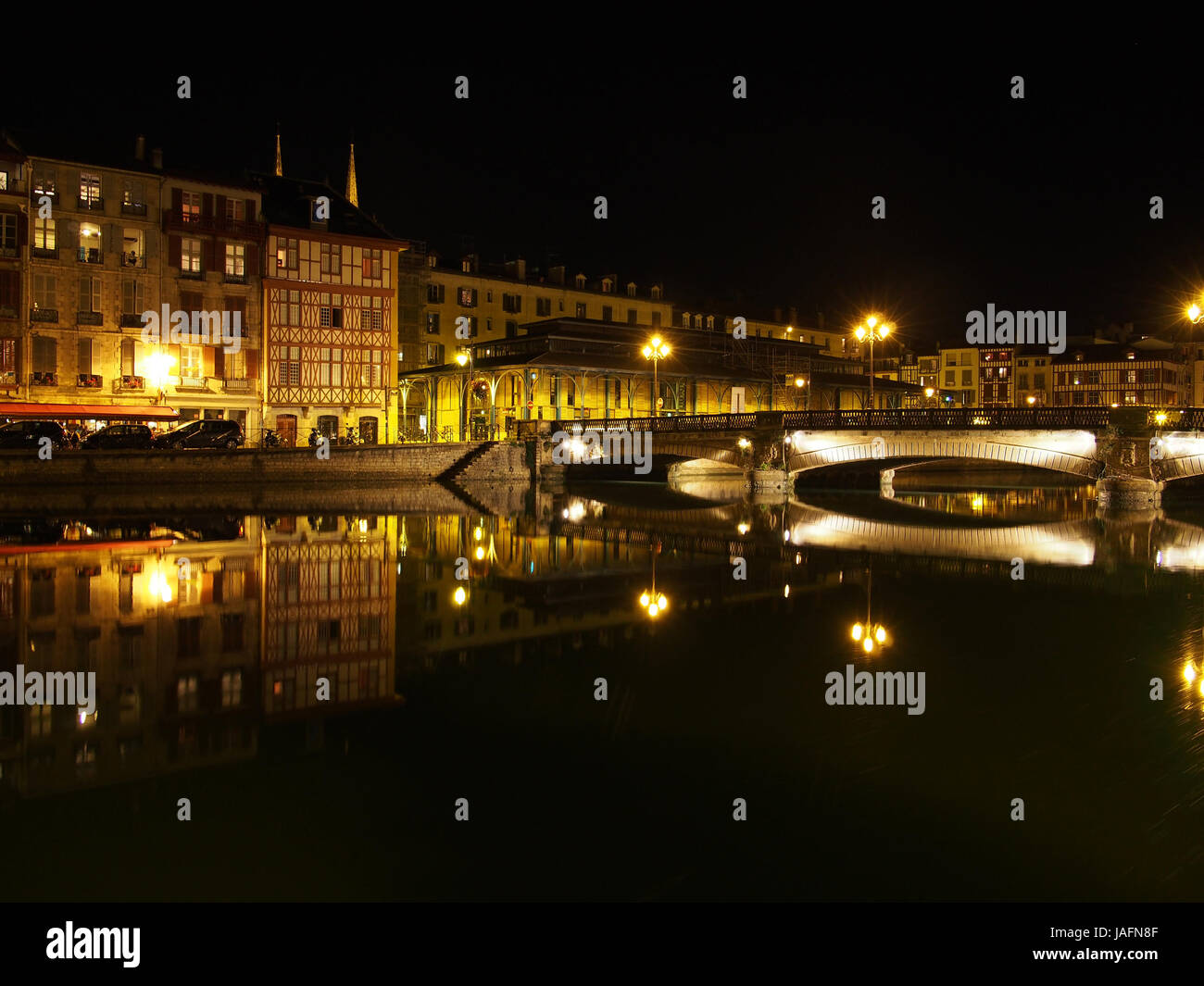 Bayonne, buildings and bridge reflection on the Nive river, France ...