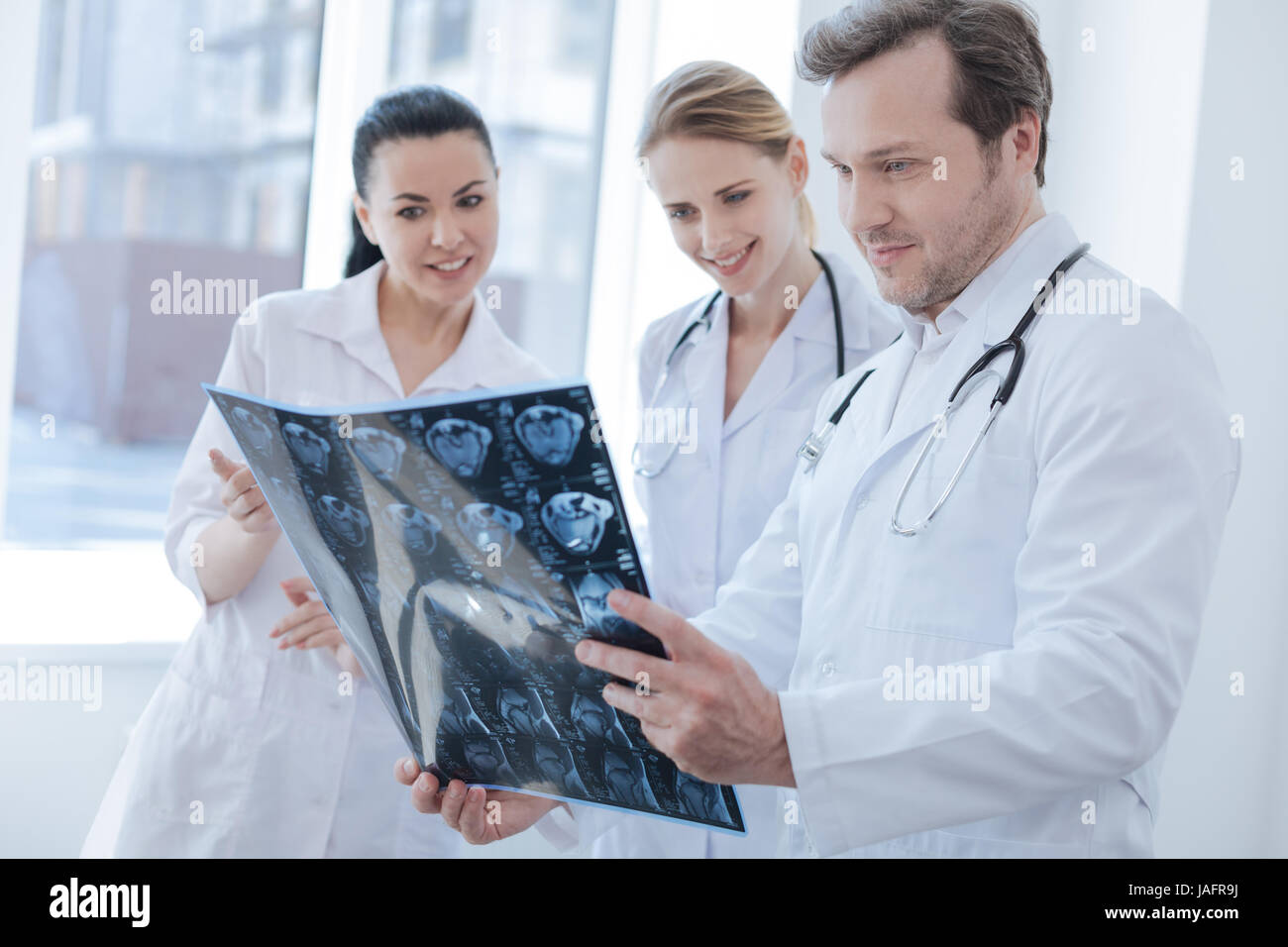 Discussing x ray image quality. Positive cheerful proficient ...