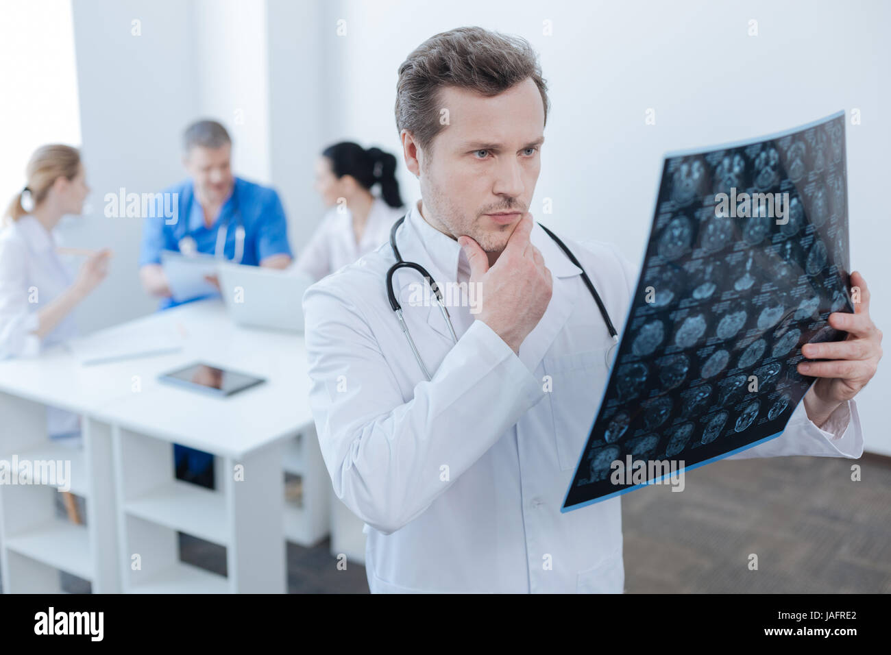 Examining brain health of patient . Serious frustrated smart ...