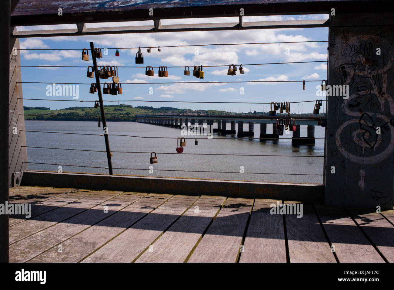 The Tay Road Bridge as seen from the north bank of the estuary of the ...
