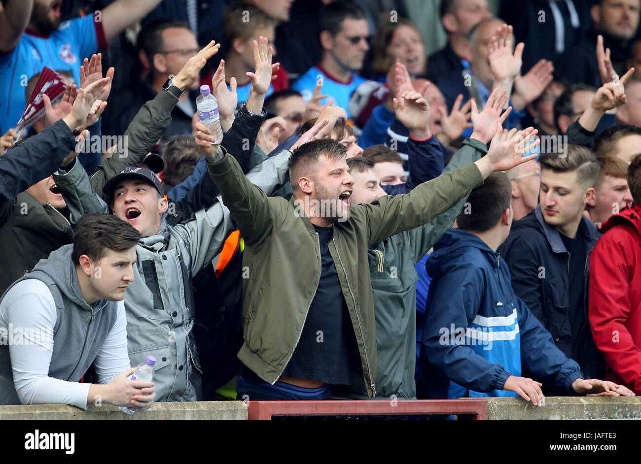 Scunthorpe United fans in the stands Stock Photo - Alamy
