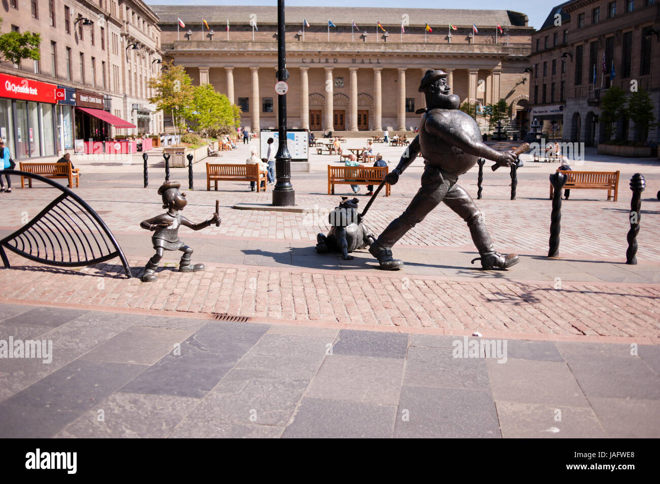 The statue of Desperate Dan in Dundee City Centre alongside a statue of ...