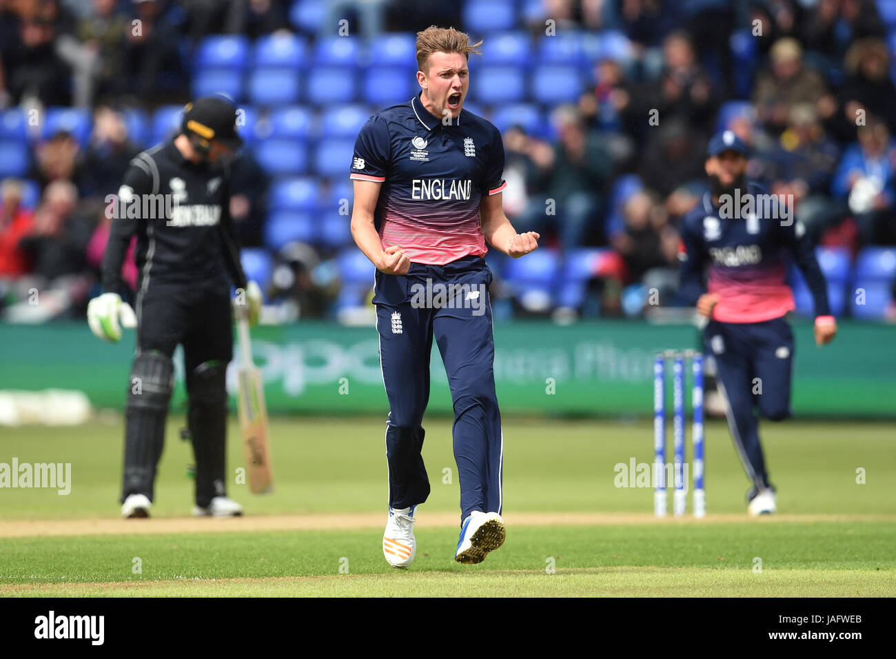 England's Jake Ball celebrates taking the wicket of New Zealand's Luke ...