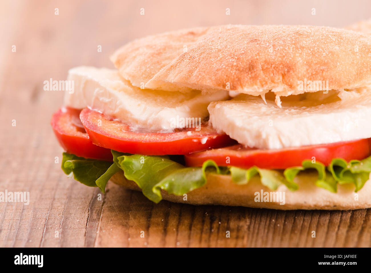 Puccia bread with mozzarella and tomato Stock Photo - Alamy