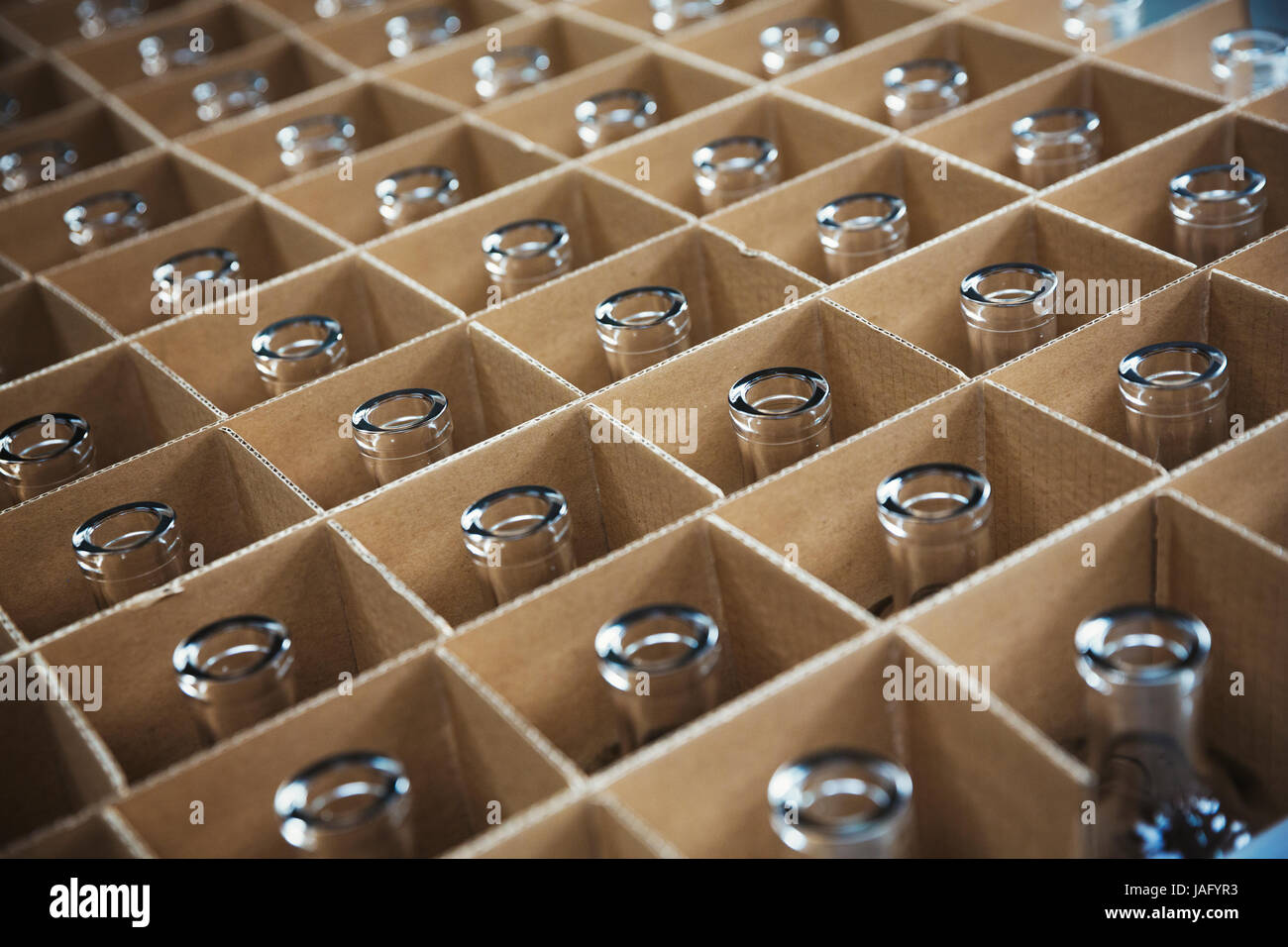 Close up of empty bottles in cardboard boxes in a distillery Stock ...