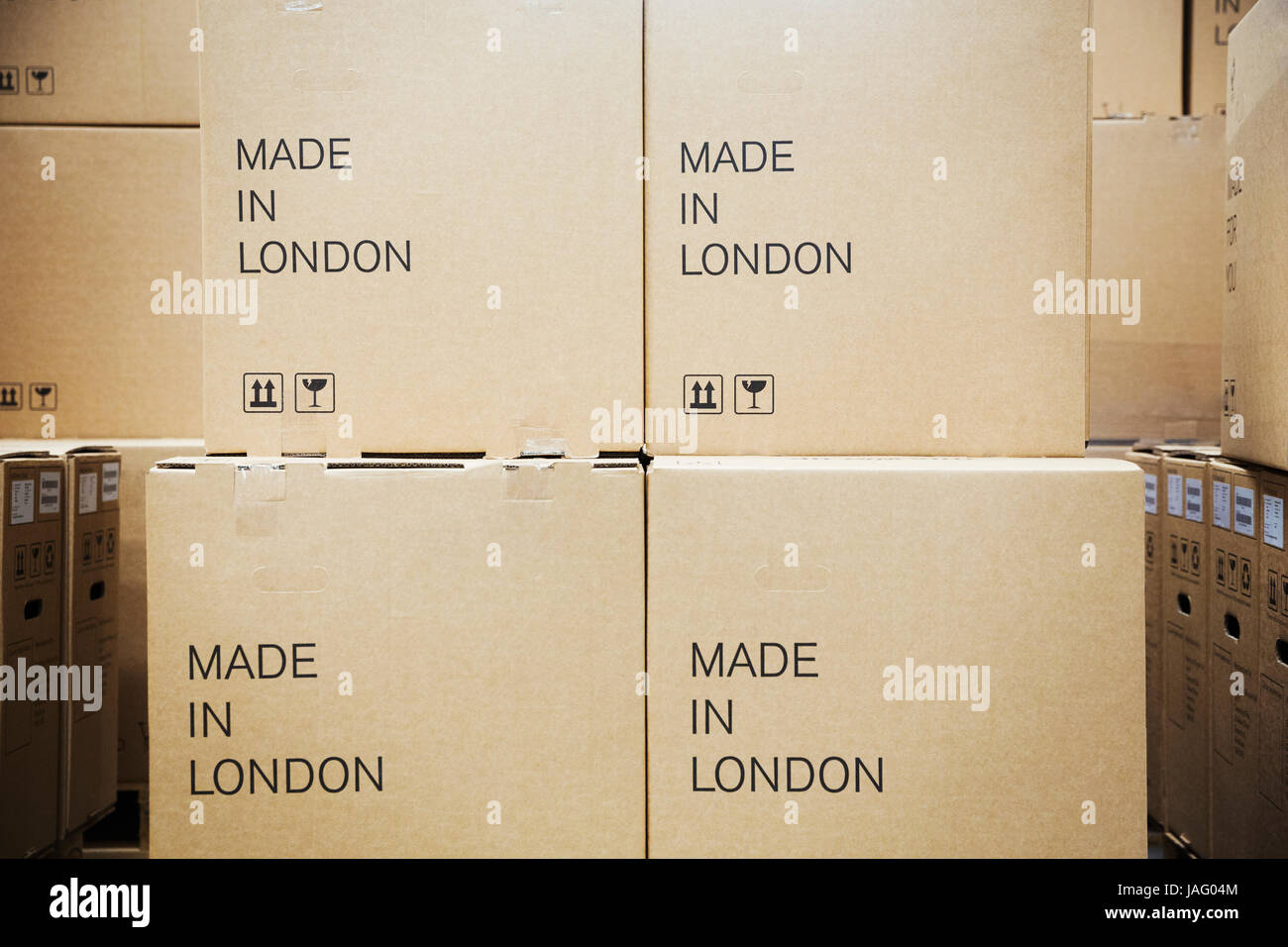 Close up of stack of cardboard boxes labelled 'Made in London;' Stock ...