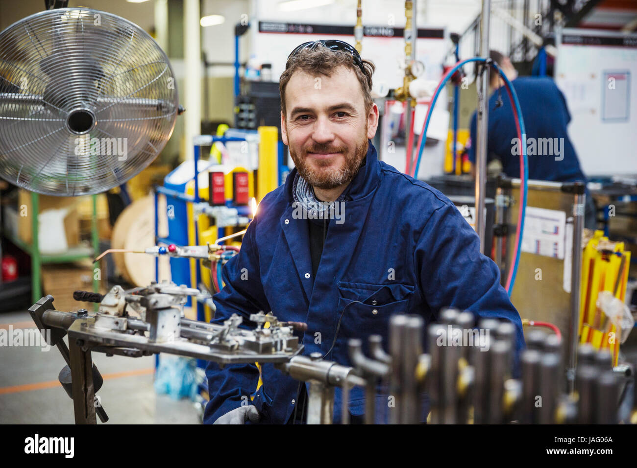 Man standing beside industrial hi-res stock photography and images - Alamy
