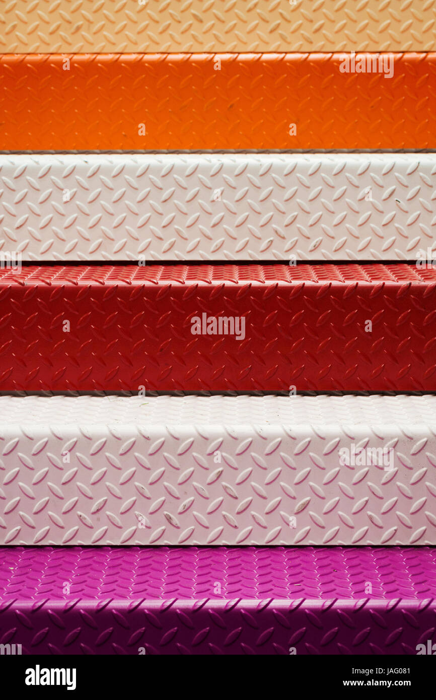 Close up of colourful metal steps and a variety of texture and raised ...