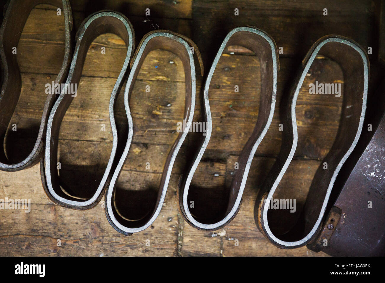Metal shoe forms, template shapes for cutting leather components, in a ...