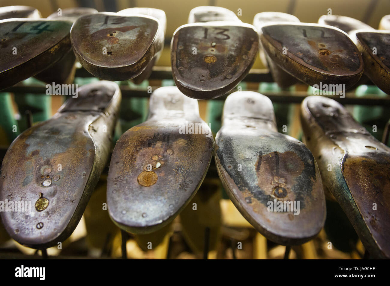 Close up of various metal shoe forms, wood and metal lasts, in a ...
