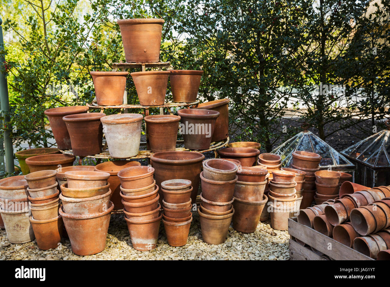 A large stack of terracotta pots in a garden Stock Photo - Alamy