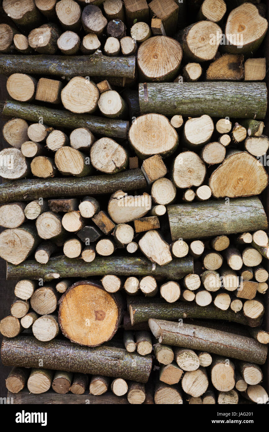 Close up of a stack of wooden logs and twigs, a log store Stock Photo ...