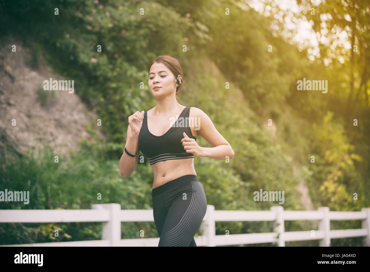 Running woman. Female runner jogging during outdoor on road .Young ...