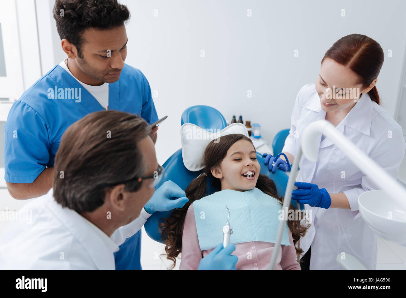 Good girl. Very attentive assistants standing around patient and bowing ...