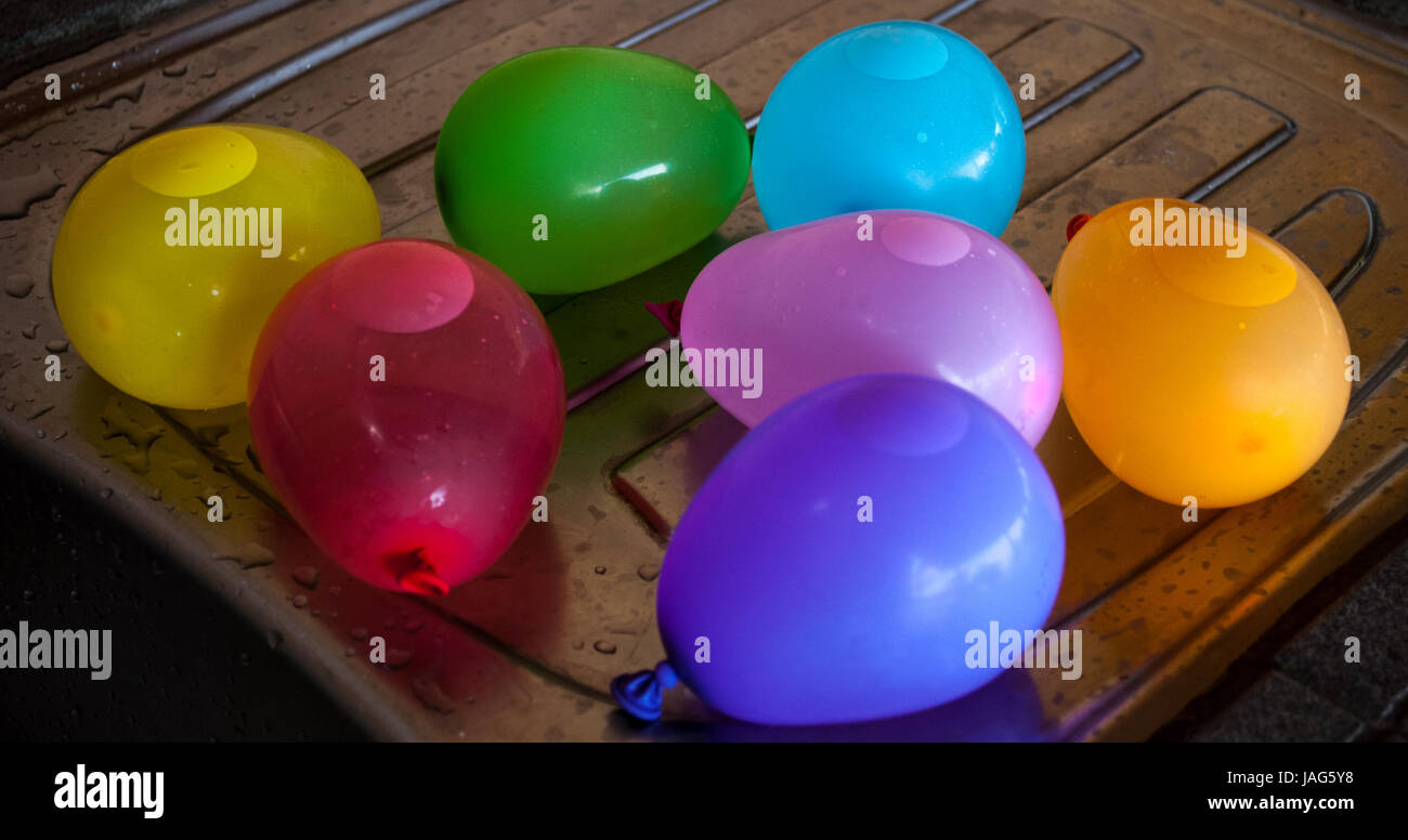 Filled water balloons waiting by the sink Stock Photo - Alamy