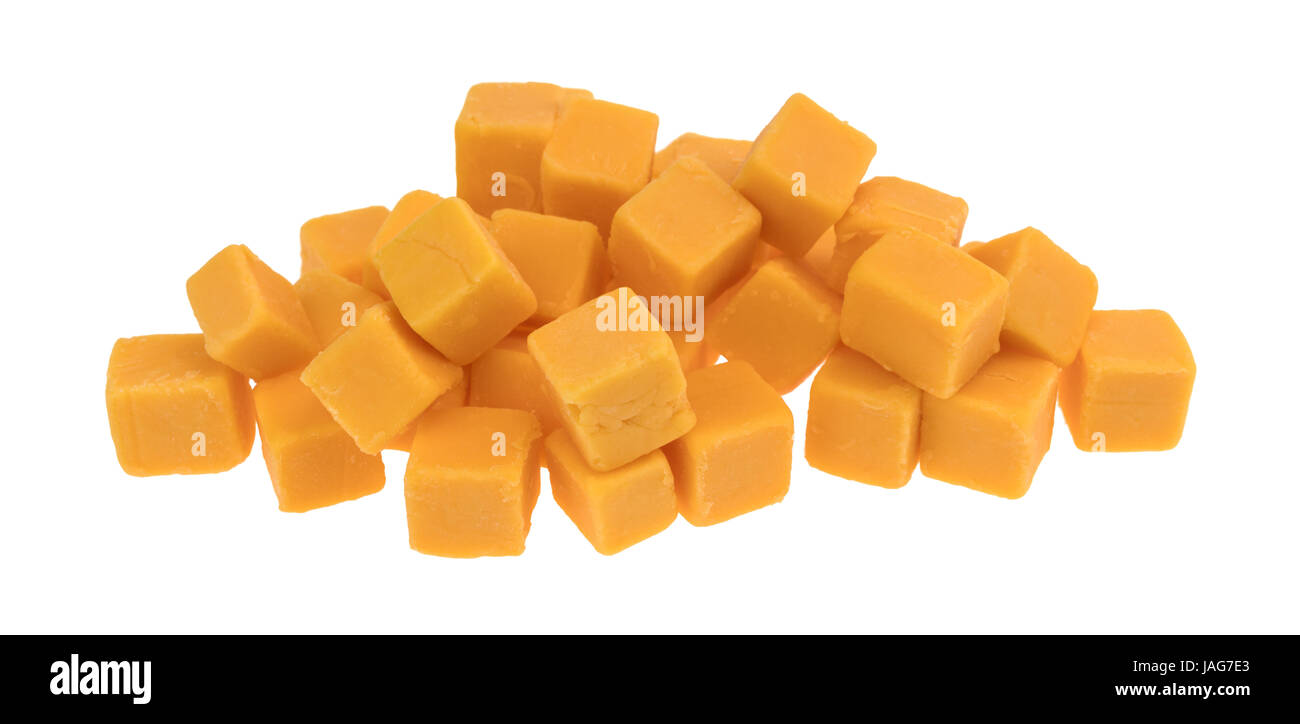 A portion of cubed mild cheddar cheese pieces isolated on a white ...