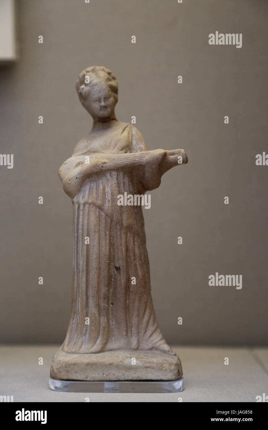 Terracotta figure. Woman playing a type of lute (pandoura). Probably ...