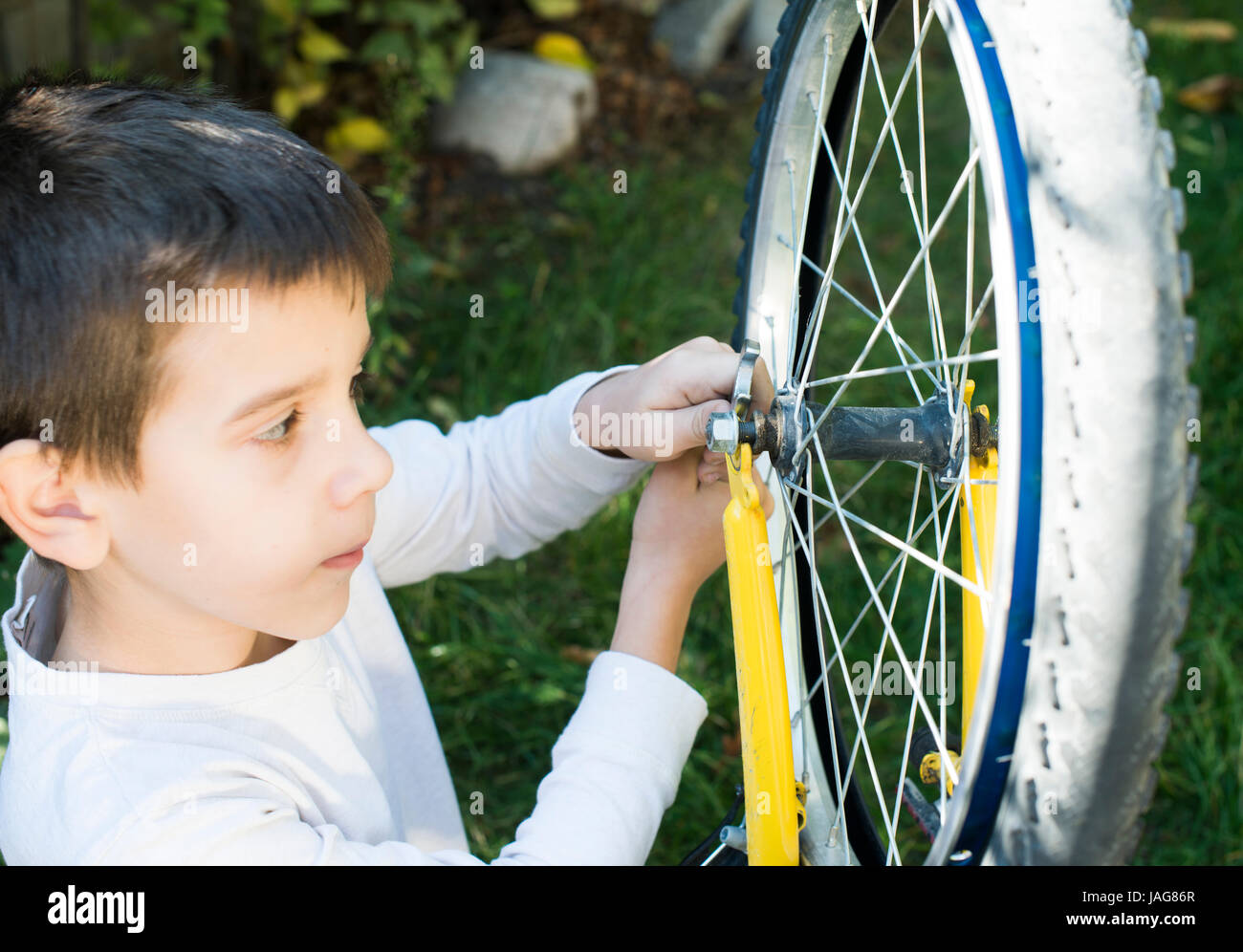 Child who fix bikes boy hi-res stock photography and images - Alamy