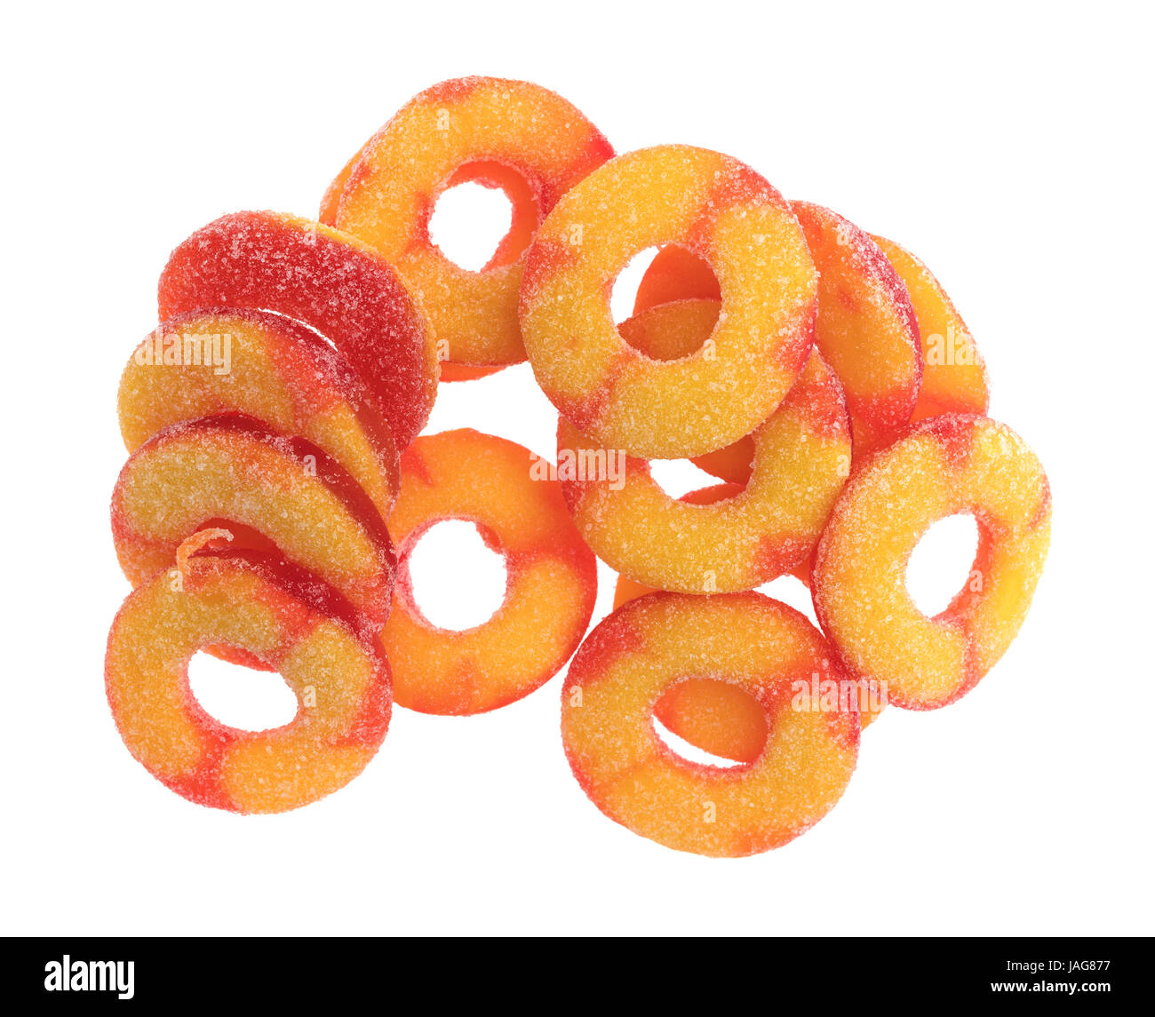 A group of peach flavored candy rings isolated on a white background ...