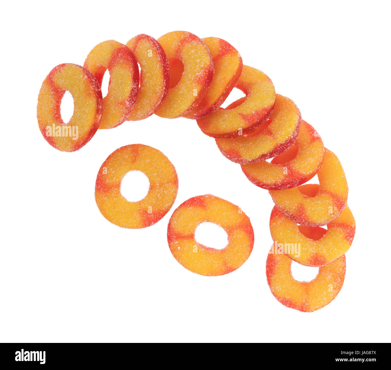 A group of peach flavored candy rings with two separate isolated on a ...