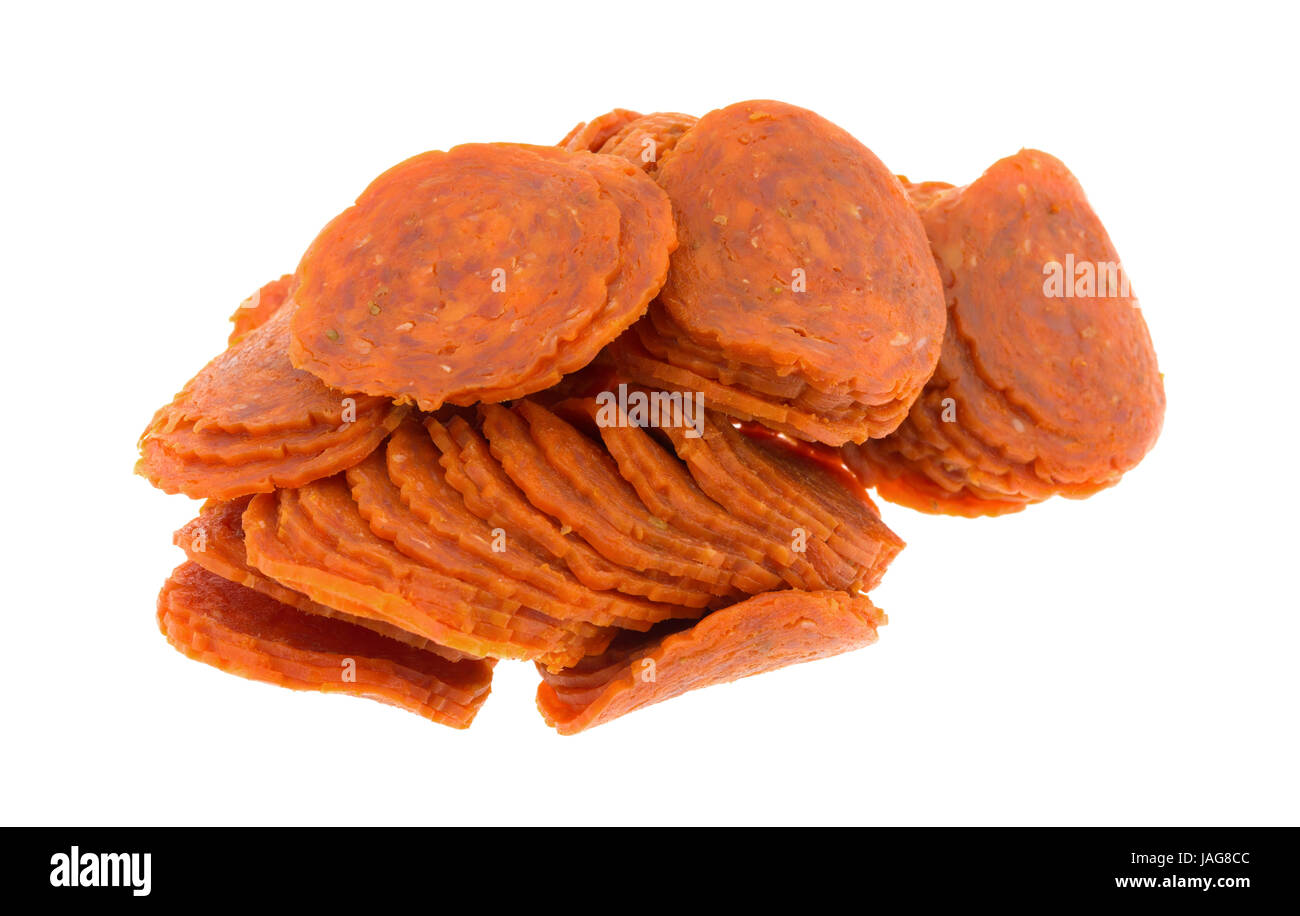 A small pile of pepperoni slices isolated on a white background Stock ...