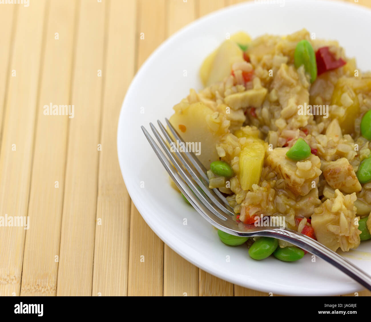 A meal of chicken, rice, water chestnuts, red peppers and pineapple ...