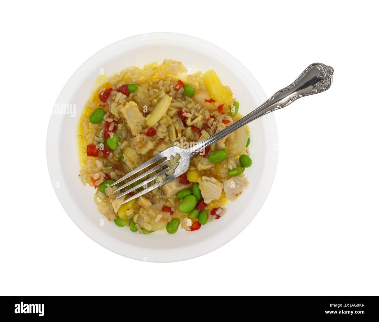 Top view of a bowl of chicken, rice, water chestnuts, red peppers and ...