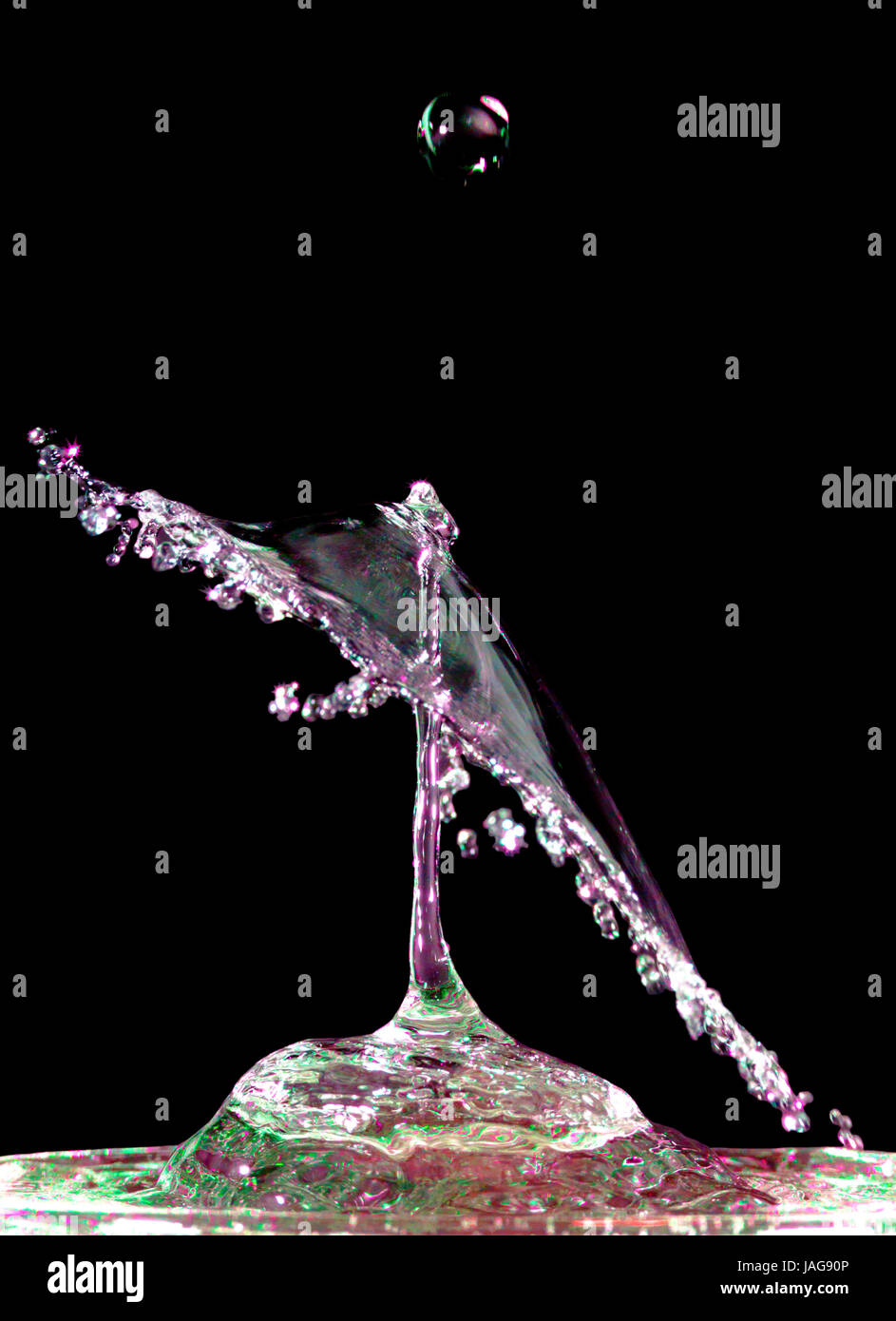 Colorful liquid splash isolated on black background closeup Stock Photo ...