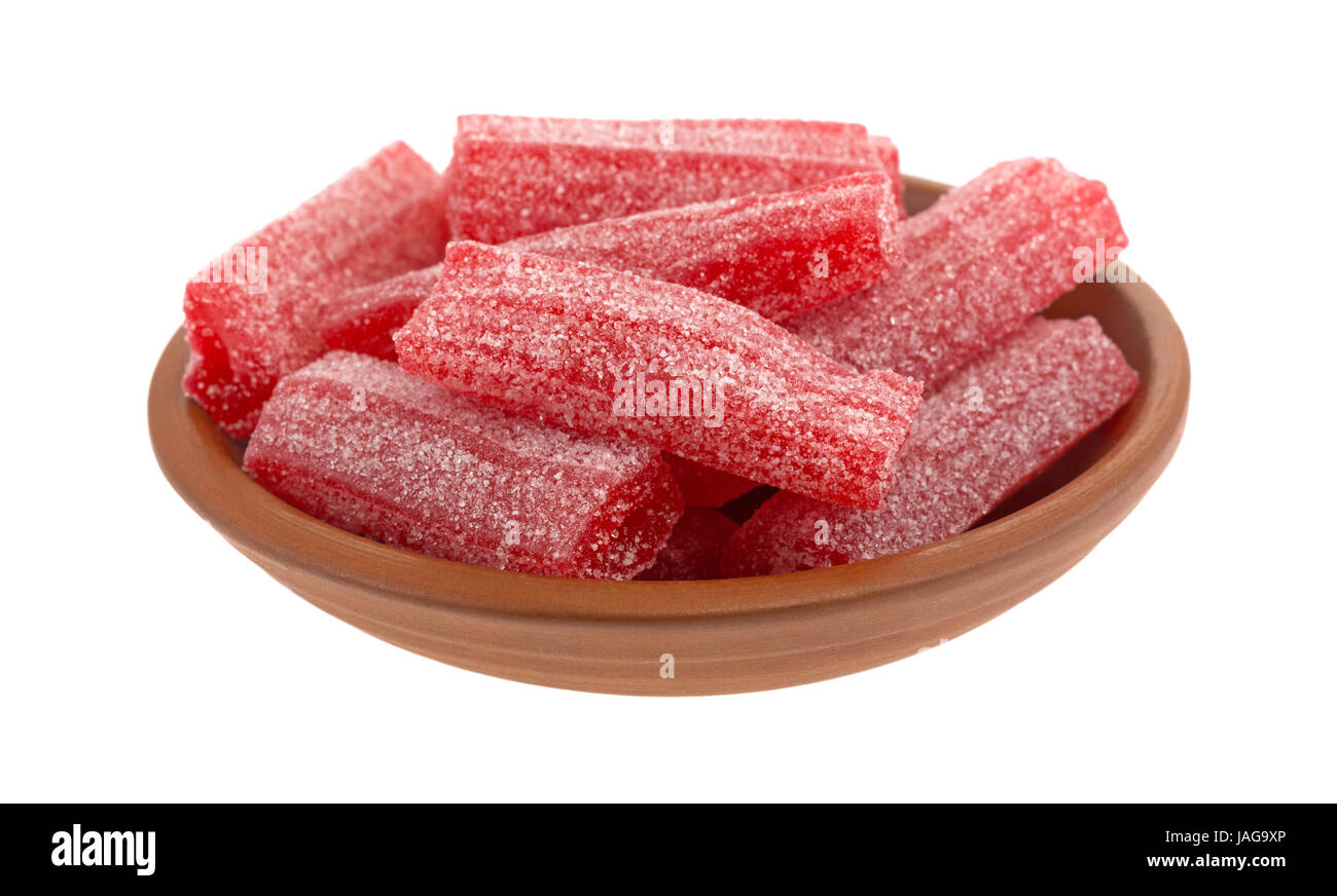 Red gummy sweet and sour sugar candy in a bowl isolated on a white ...