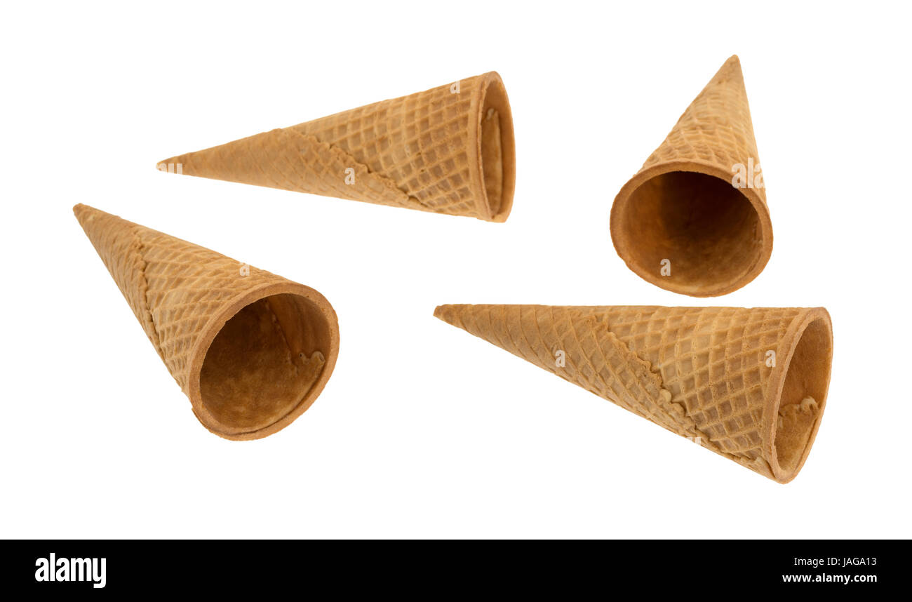 Four empty ice cream waffle sugar cones isolated on a white background ...